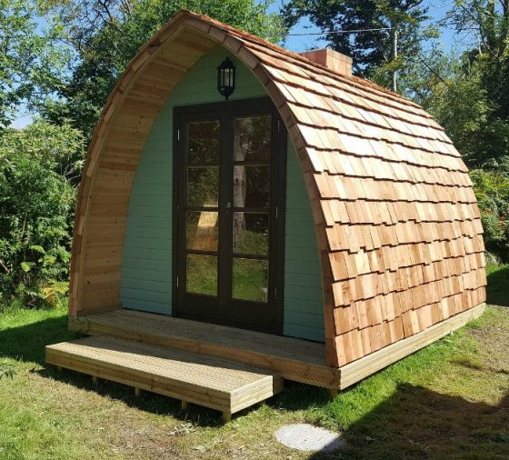 Garden Sheds add a Whimsical Touch to a Back Yard